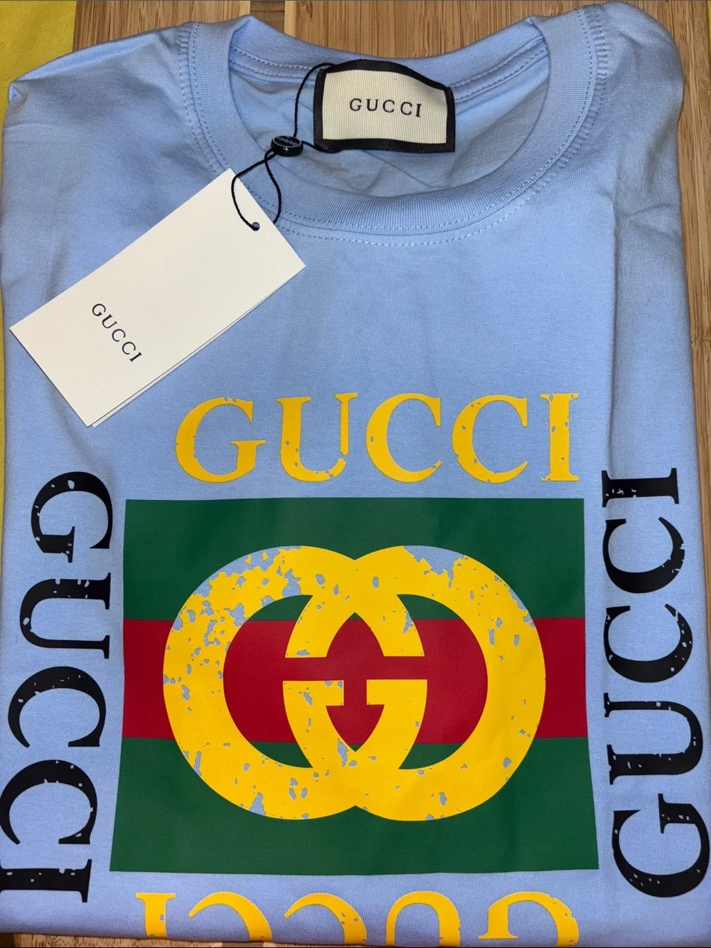 Fashion T-shirt | Shirts | Light Blue Tee With Yellow Logo And Greenred ...